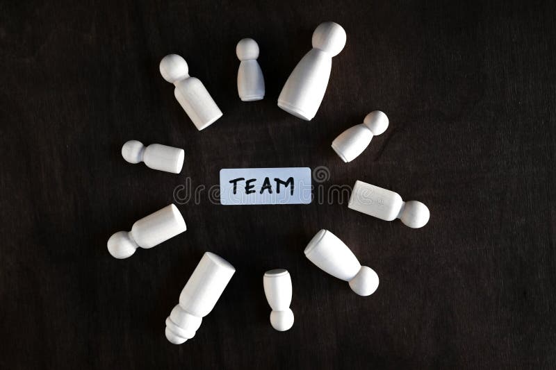 Wooden Peg Dolls in a Team - Concept Photo Representing Team Work and ...