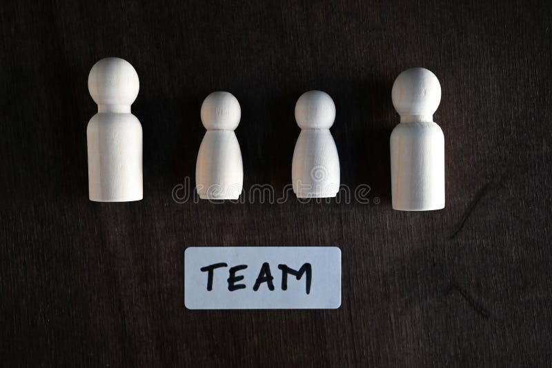 Wooden Peg Dolls in a Team - Concept Photo Representing Team Work and ...
