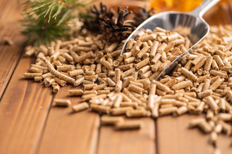 Wooden Pellets in Scoop on Wooden Table Stock Image - Image of closeup ...