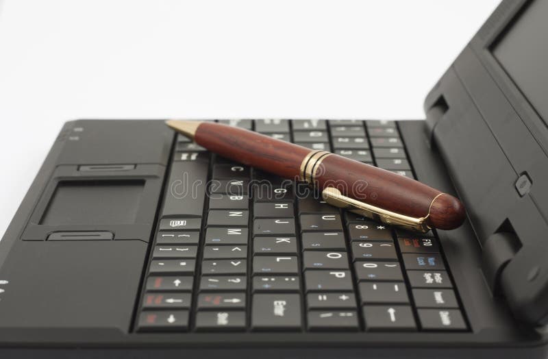 The Wooden Pen on Notebook Keyboard Stock Photo - Image of brown ...