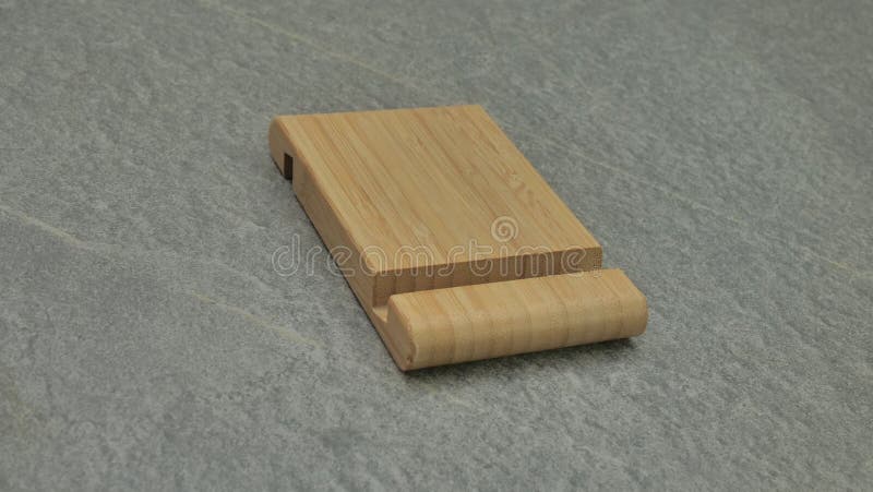 Wooden Phone Holder on Ceramic Table, Side View Stock Photo - Image of ...