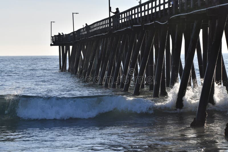 View of Fishermen on a Pacific Ocean Pier Seen from the Beach Stock ...