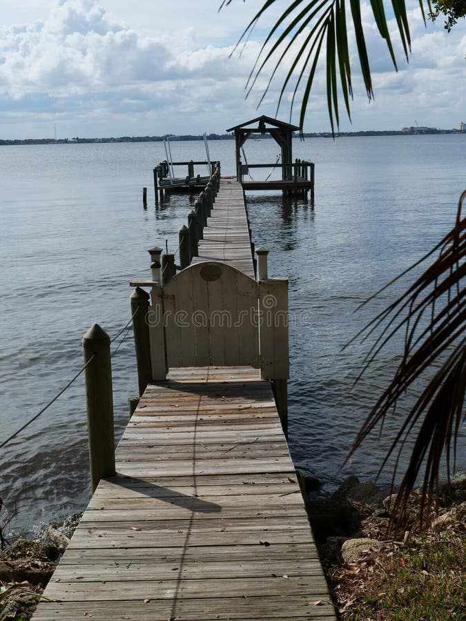 A wooden pier with a gate stock photo. Image of vehicle - 273379242