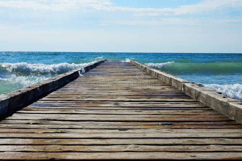 Wooden Pier Leading into the Blue Sea Stock Photo - Image of jetty ...