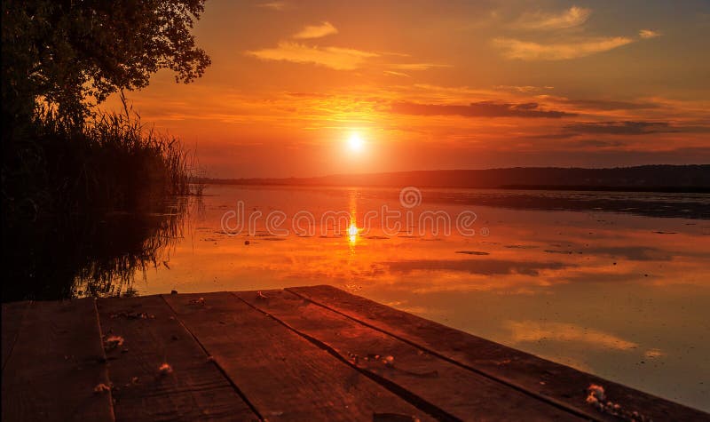 Wooden Pier Over the Water. at Sunset Stock Photo - Image of golden ...