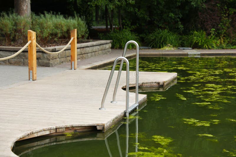 Wooden Pier and Pond with Ladder in Park Stock Image - Image of ...