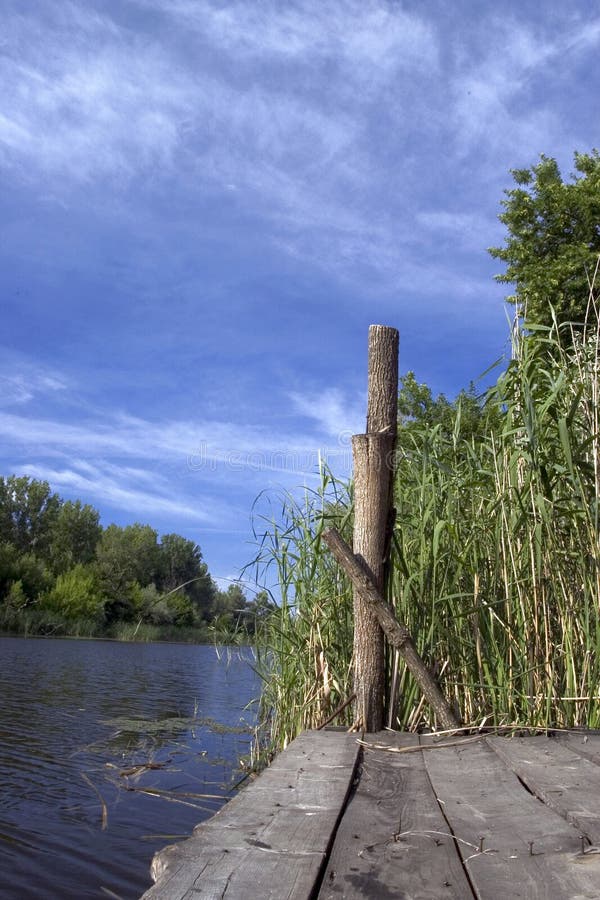 Wooden pier on river stock photo. Image of raised, remote - 543112