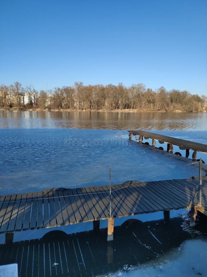 Wooden Pier on a River Covered with Ice in Winter Stock Image - Image ...