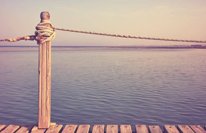Wooden Pier Rope Railing, Selective Focus, Color Toning Applied Stock ...