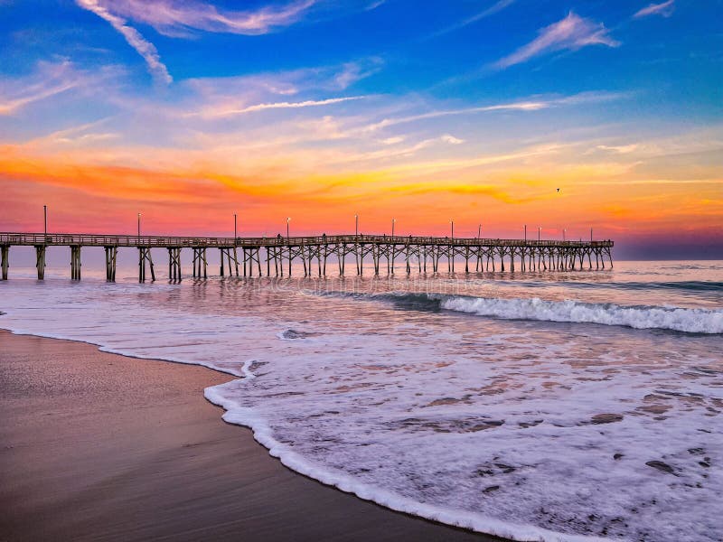 Wooden Pier at a Sandy Beach on the Sunset Stock Photo - Image of shore ...