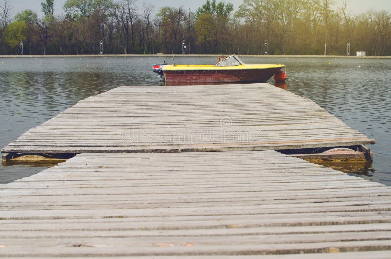 Wooden Pier in a Sunny Day with Parked Boat Stock Image - Image of ...