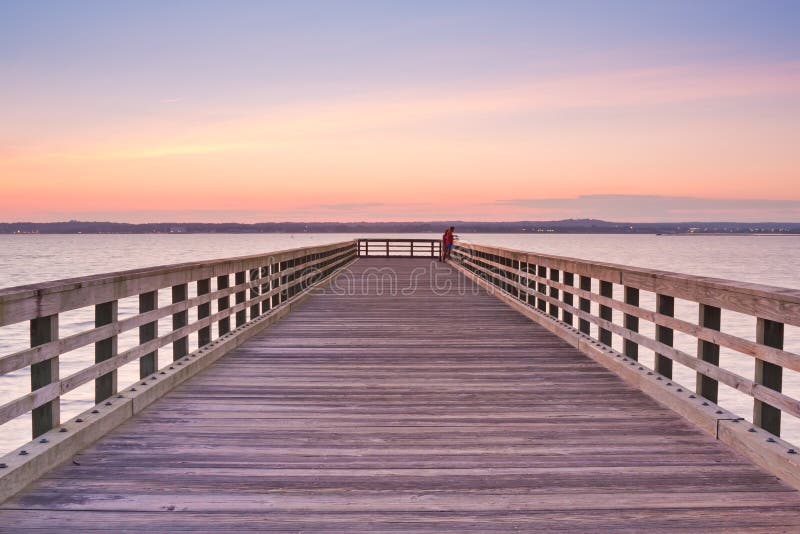Wooden Pier at sunset stock photo. Image of lines, beach - 14209666