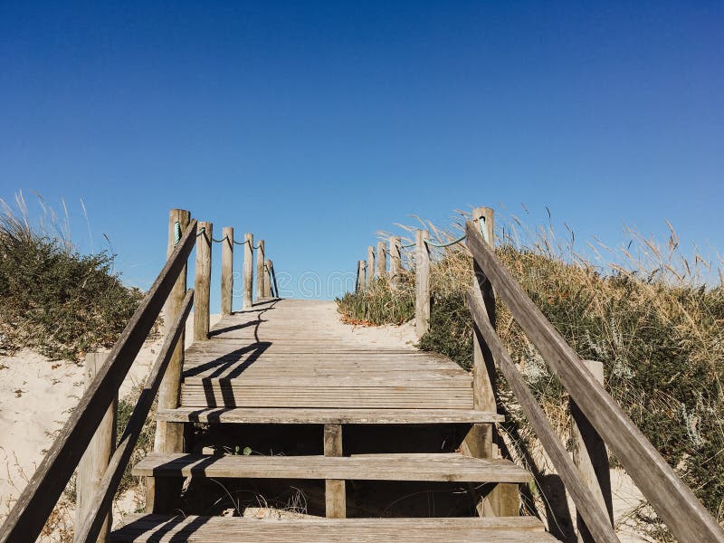 Wooden Pier Under a Blue Clear Sky Stock Photo - Image of pier ...