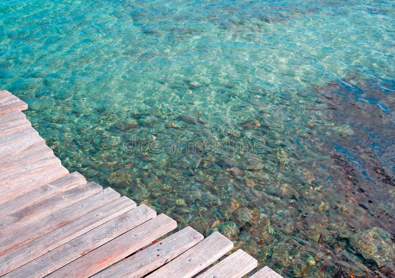 Wooden pier on water stock photo. Image of italy, seaside - 29286840