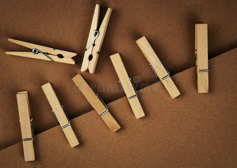 Wooden pins on brown paper stock image. Image of poster - 112708607