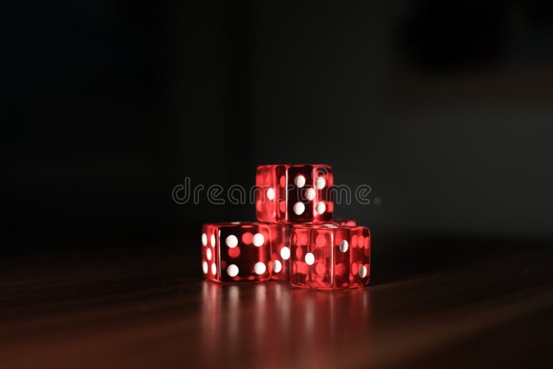 On a Wooden Plate There are 5 Red Dice Next To Each Other Stock Photo ...