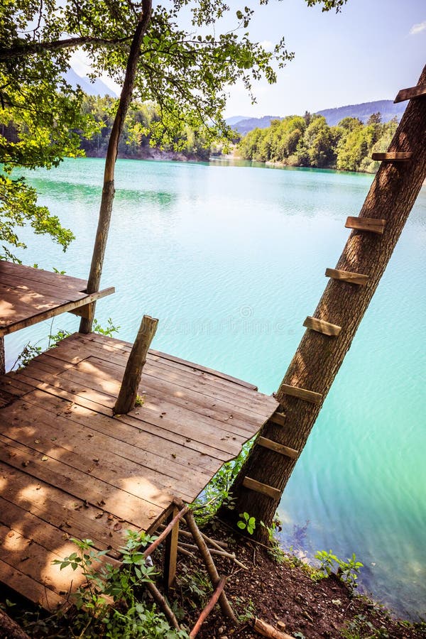 Wooden Platform and a Beautiful Blue Lake, Playground Stock Image ...