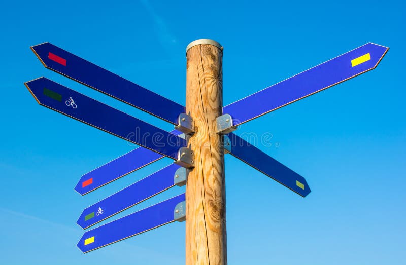 Wooden Pole with Direction Arrows Stock Image - Image of movement ...