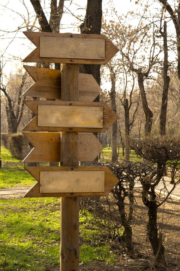 Wooden Pole with Direction Indicators Stock Image - Image of landscape ...