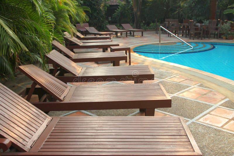 Wooden Pool Trestle Beds By The Poolside Stock Image - Image of heat ...
