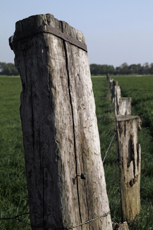 Wooden Post of a Farmland Fence Stock Photo - Image of landscape, blue ...
