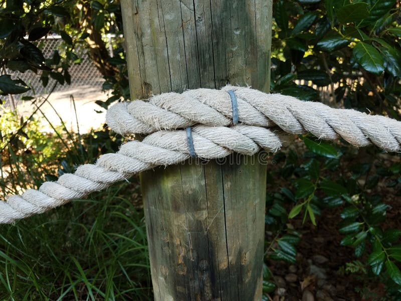 Wooden Post Or Pole With Rope Tied Around It Stock Image - Image of ...