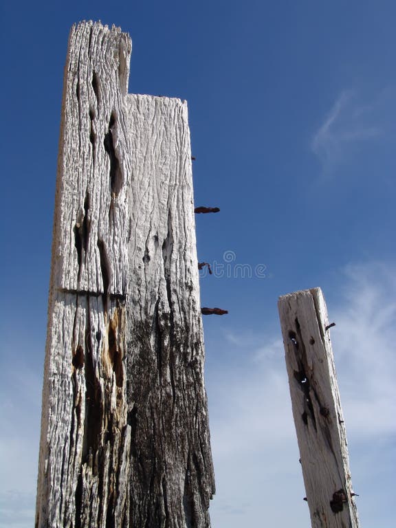 Wooden Posts stock photo. Image of nails, posts, rust, clouds - 95222