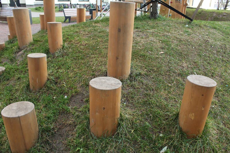 Wooden Posts of Different Heights on the Playground Stock Photo - Image ...