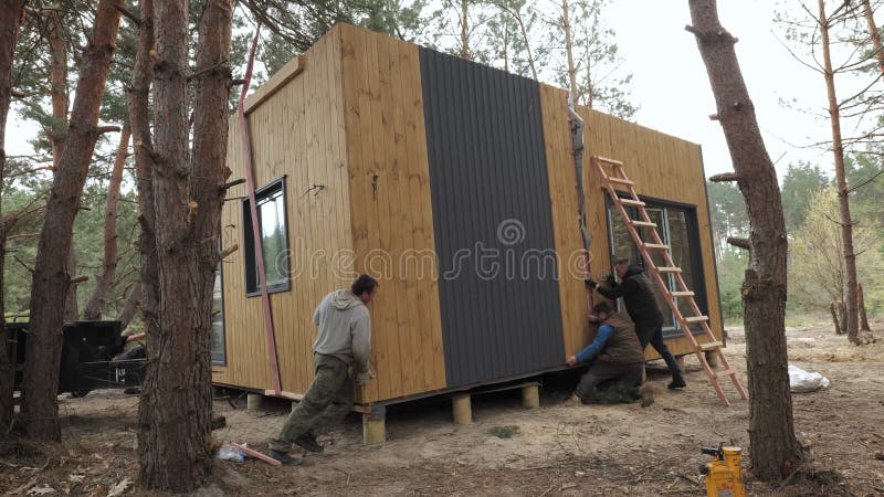 Small Wooden Cabin Installation in Forest Setting Stock Footage - Video ...