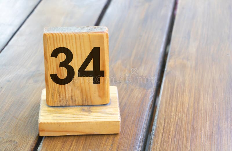 Wooden Priority Number 34 on a Plank Tab Stock Photo - Image of ...
