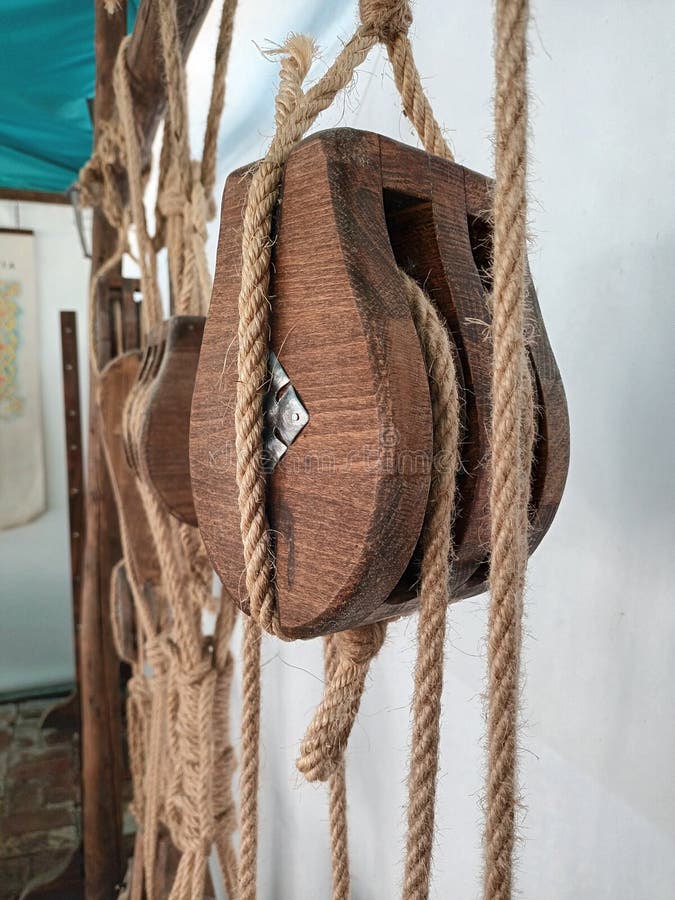 Wooden pulley with a rope editorial stock image. Image of design ...