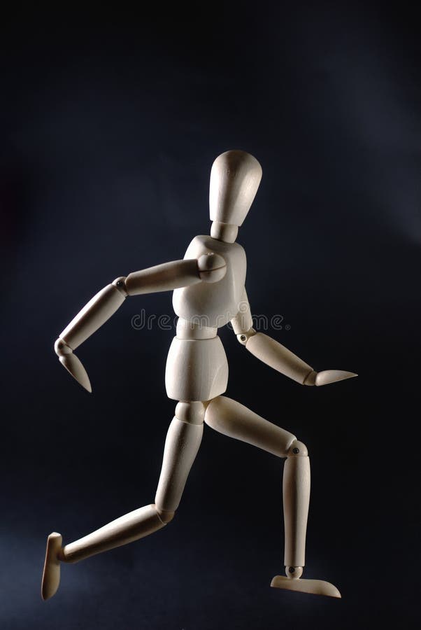Wooden puppet is running stock photo. Image of active - 61392646
