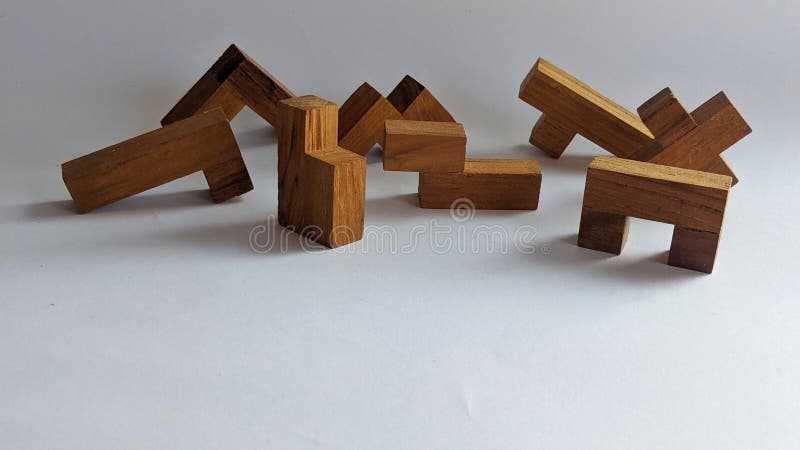 A Wooden Puzzle Box with Various Wooden Pieces Inside. the Box Has a ...