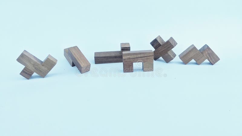 A Wooden Puzzle Box with Various Wooden Pieces Inside. the Box Has a ...