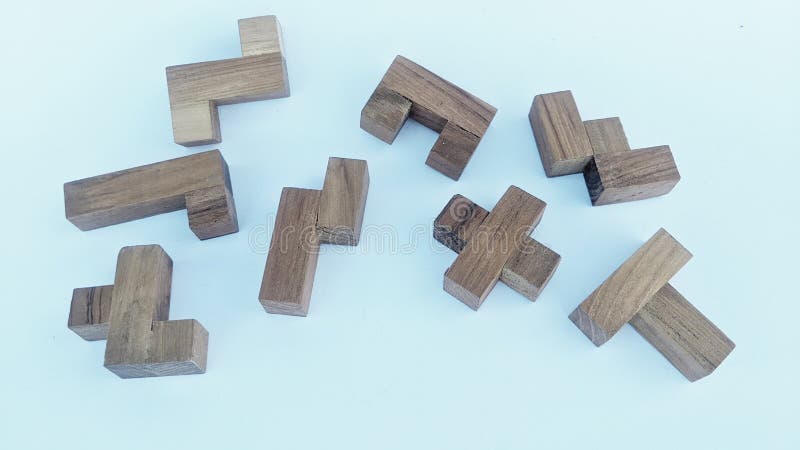 A Wooden Puzzle Box with Various Wooden Pieces Inside. the Box Has a ...