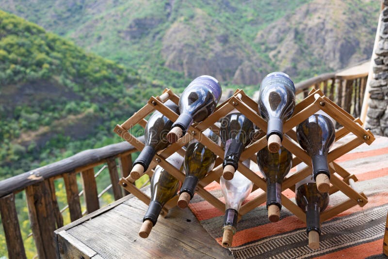 Wooden Rack with Empty Wine Bottles Stock Photo - Image of mountain ...