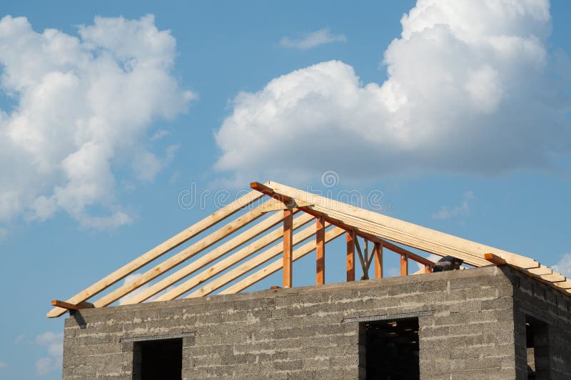Wooden Rafters of a New Home Under Construction at Sunset Stock Image ...