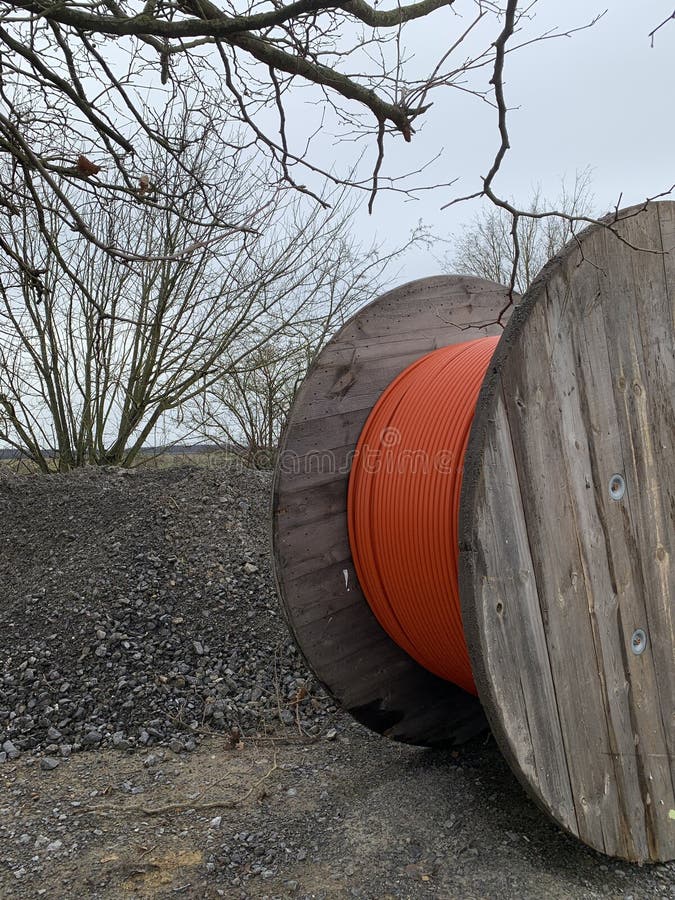 A Wooden Reels with Ann Orange Cable on a Construction Site Stock Image ...