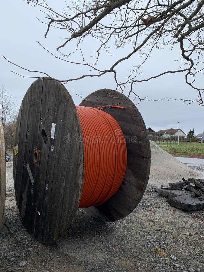 A Wooden Reels with an Orange Cable on a Construction Site Stock Photo ...