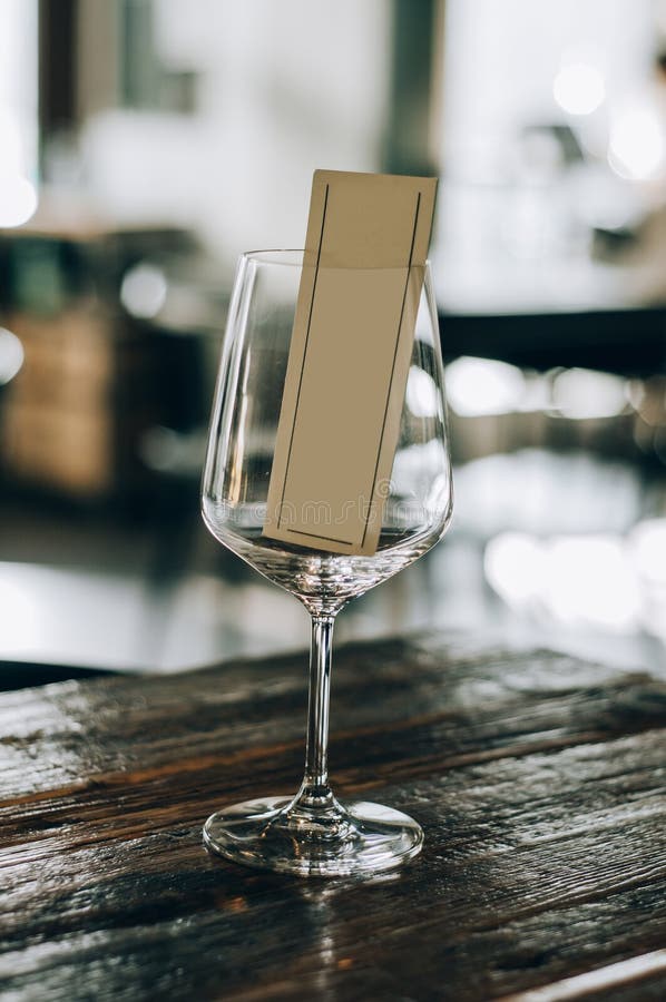 Wooden Reserved Plate on Restaurant Table with Empty Dishes and Glasses ...