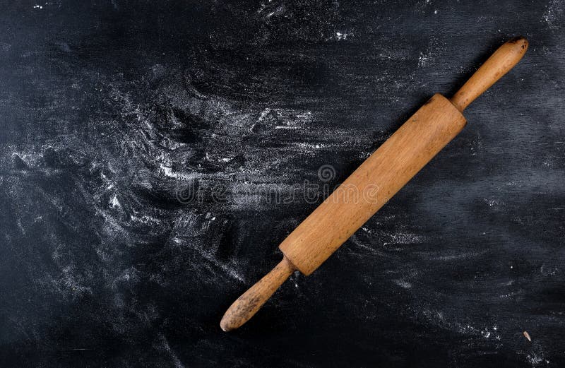 Wooden Rolling Pin on a Black Background Stock Photo - Image of ...