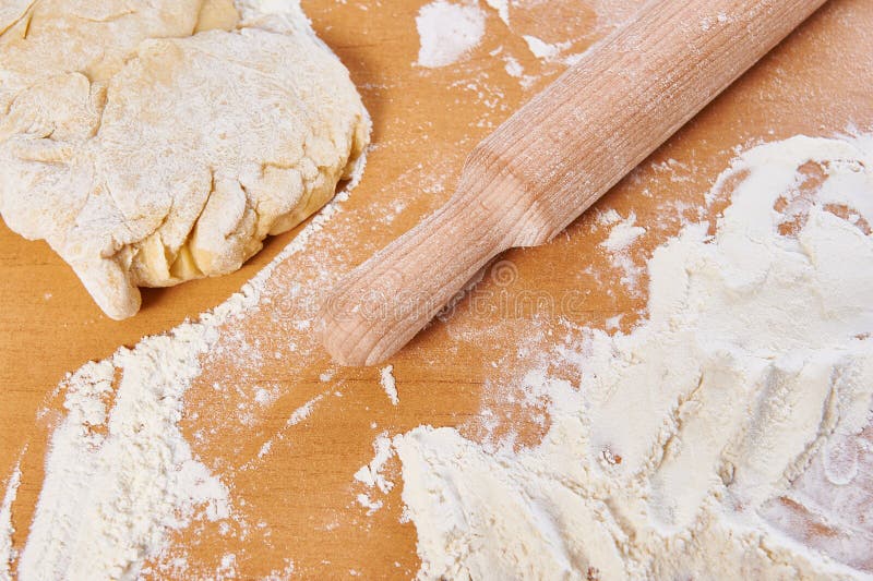 Wooden Rolling Pin and Dough on Kitchen Table Stock Photo - Image of ...