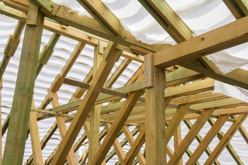 Wooden House Frame. Roof Support Beams in Home Under Construction Stock ...