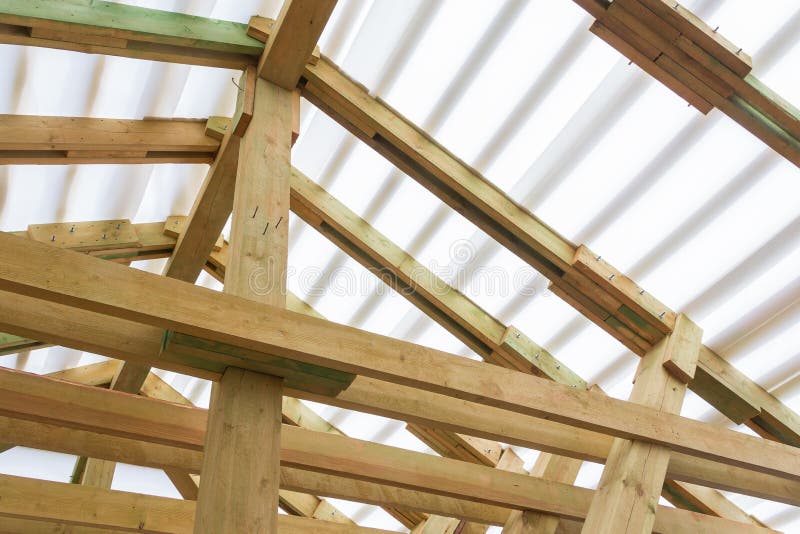 Wooden House Frame. Roof Support Beams In Home Under Construction Stock ...