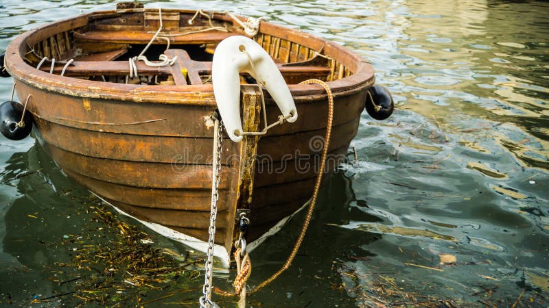 Wooden rowboat in harbour stock photo. Image of rowboat - 150666330