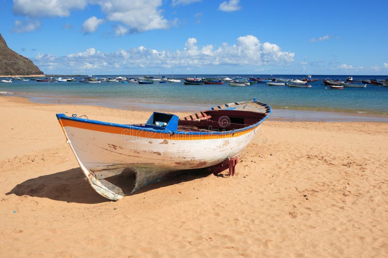 Wooden rowboat on beach stock photo. Image of climate - 11338346