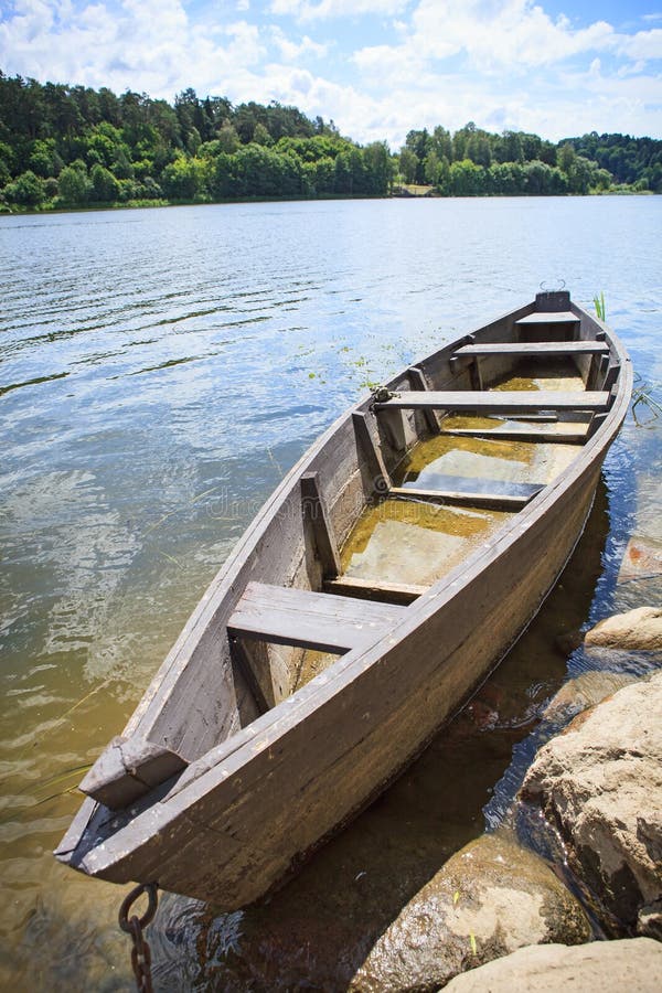Wooden Rowing Boat on Lake Shore Stock Photo - Image of green ...