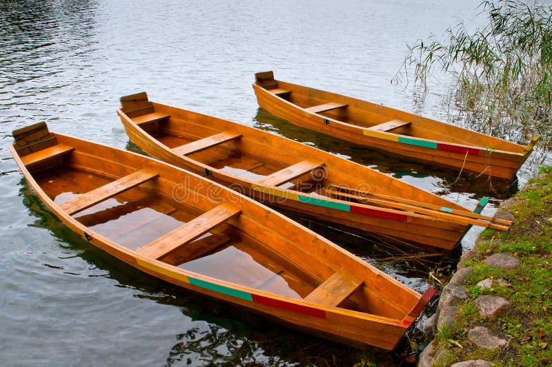 Wooden Rowing Boat Near the Shore Stock Image - Image of boats, lake ...