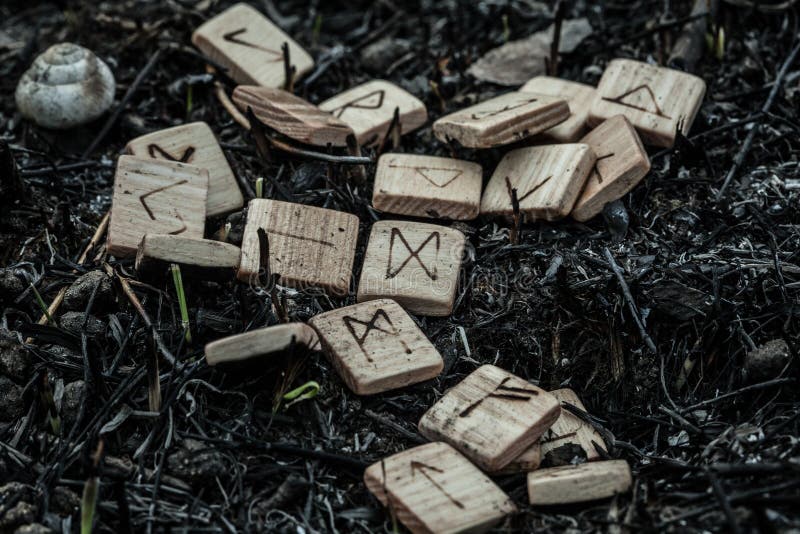 Wooden runes on the ground stock image. Image of burned - 53102981