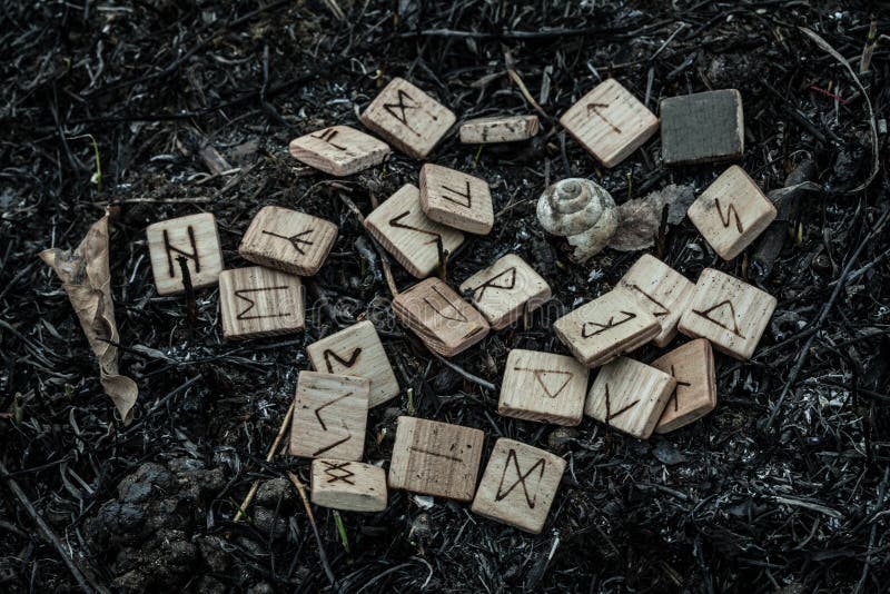 Wooden runes on the ground stock photo. Image of pile - 53103012